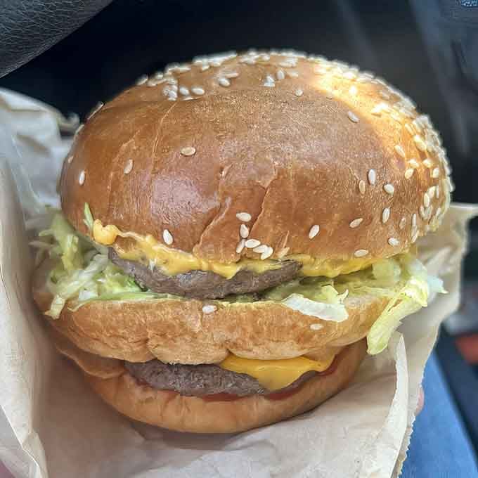 The Double Decker sits there like a delicious dare, challenging your jaw's maximum opening capacity.