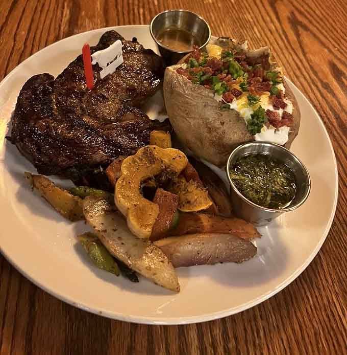 That perfectly charred ribeye with loaded baked potato is basically a love letter written in beef.