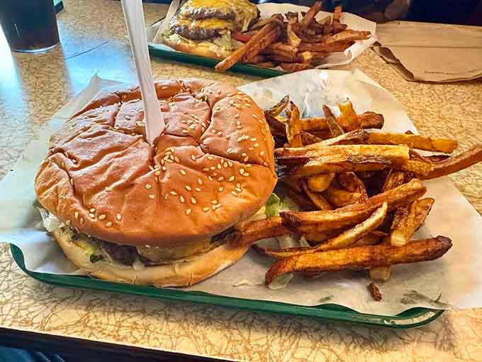 The Jumbo Cheeseburger arrives like it's auditioning for a superhero movie, cape of melted cheese included.