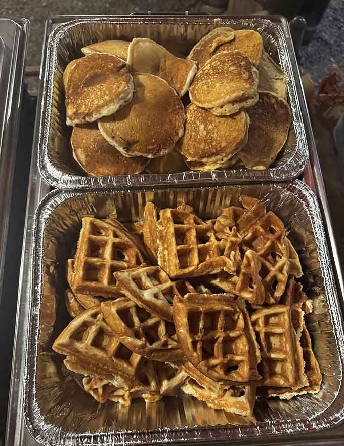 Golden pancakes and crispy waffles stacked like edible architecture, ready to fuel your morning ambitions.