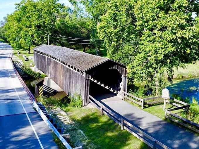 The modern road leads to timeless beauty, where horse-drawn carriages once clip-clopped through this very tunnel.
