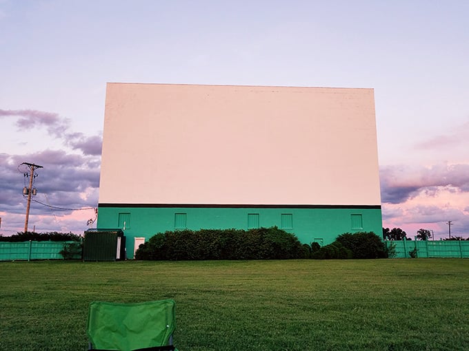 The massive screen stands ready for showtime, a beacon of entertainment visible from the highway itself.