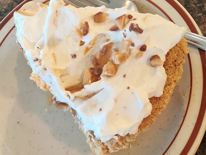 This towering slice of meringue pie proves that sometimes the best things in life are gloriously excessive.