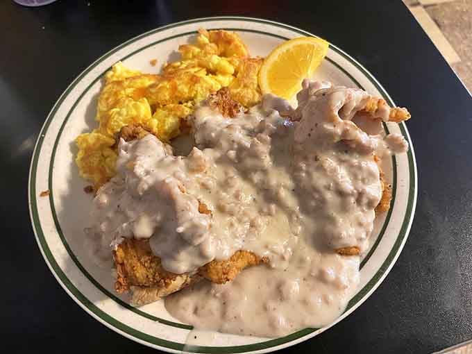When fried chicken meets sausage gravy on a biscuit, you're witnessing the kind of culinary genius that changes lives.