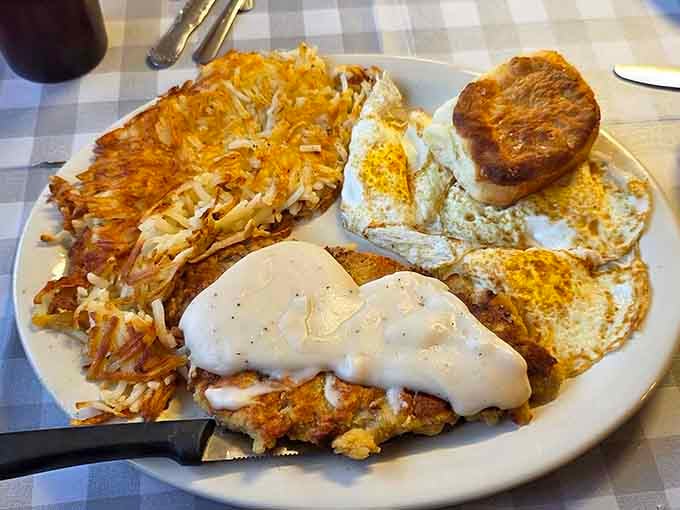Golden hash browns, perfectly cooked eggs, and country gravy over chicken fried steak: this is breakfast done absolutely right.