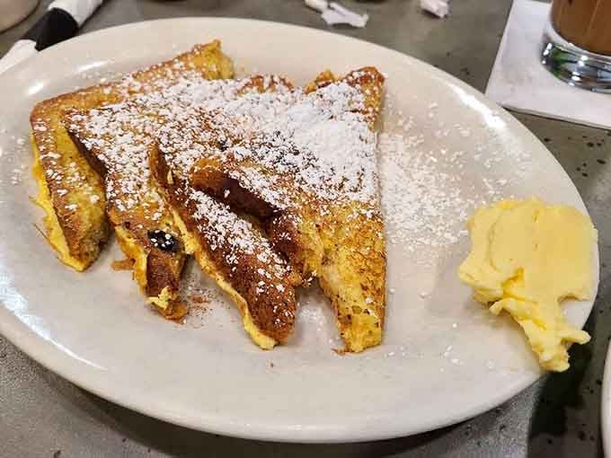 Three glorious slices of French toast proving that sometimes bigger really is better for breakfast happiness.