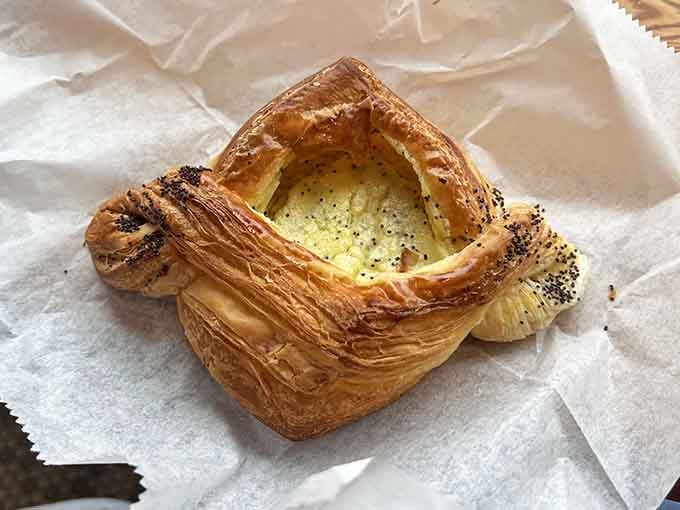 This flaky, golden pastry with its poppy seed crown is what happens when butter meets ambition in the oven.