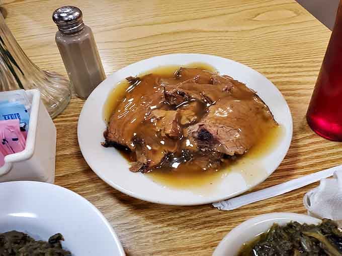 Roast beef swimming in rich gravy proves that sometimes the simplest dishes deliver the most soul-satisfying flavors.