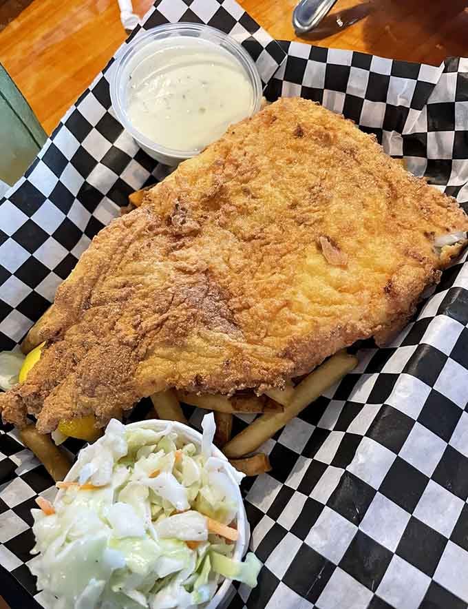 Golden-crusted haddock so massive it practically needs its own zip code, served with proper tartar sauce.