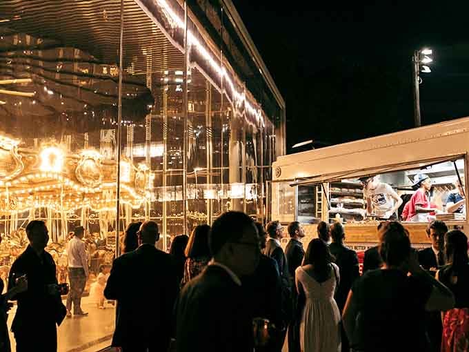 Even carousels need snacks nearby, because spinning in circles works up an appetite for everyone watching.