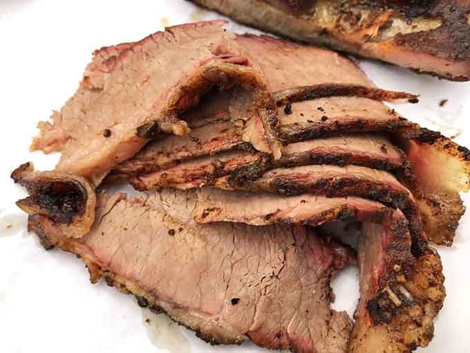 That perfect smoke ring and tender bark on this brisket proves patience and skill create barbecue magic worth celebrating.