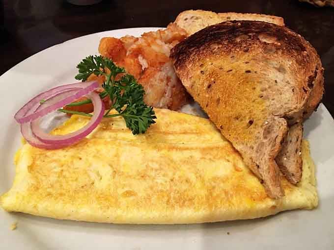 When your omelet arrives this beautifully golden and generously portioned, you know you've made all the right life choices today.