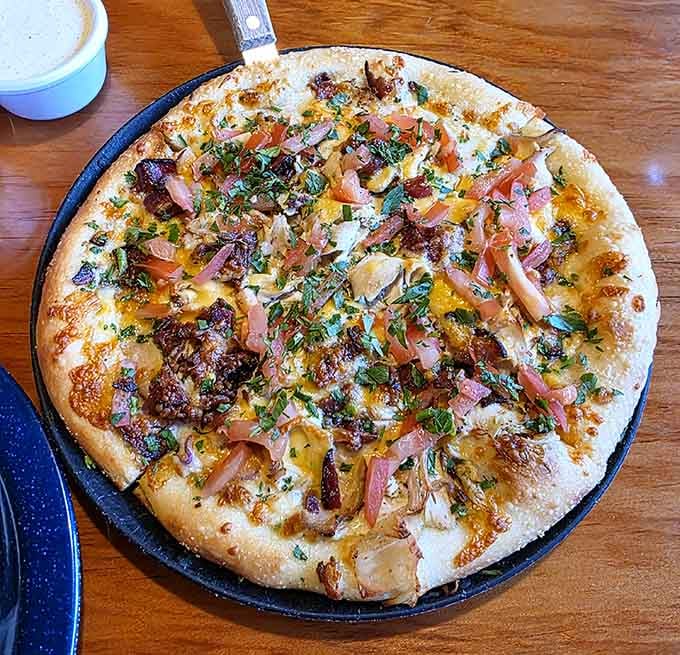 The Chicken Ranch Pizza proves that sometimes the best ideas come from thinking way outside the traditional pizza box.