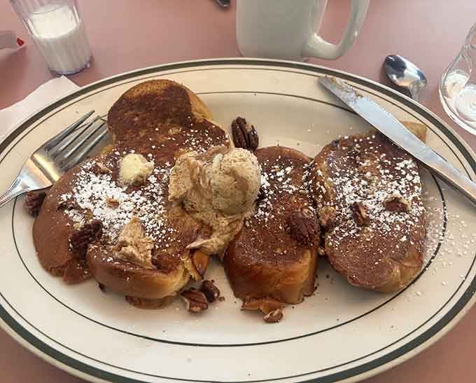 French toast dusted with powdered sugar and crowned with butter&mdash;breakfast royalty served on honest china.