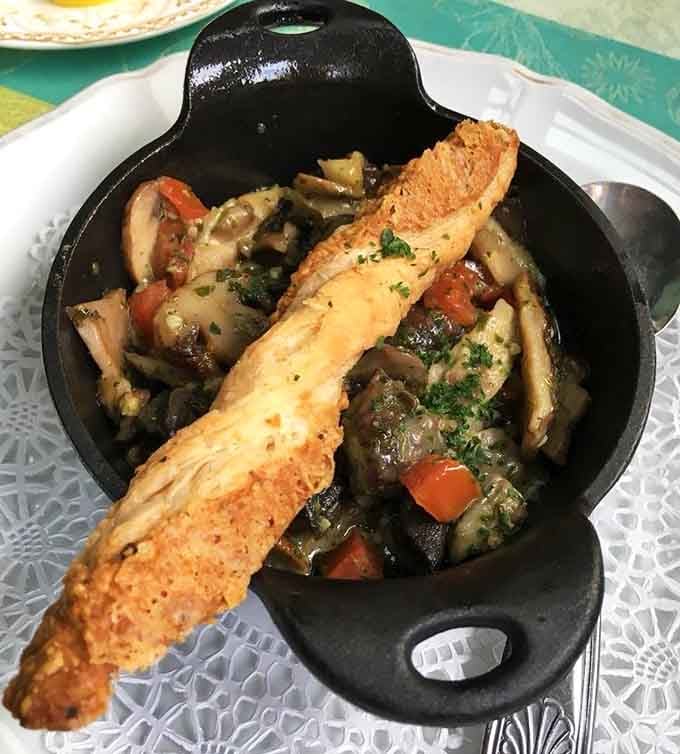 Escargot swimming in garlic butter, because some French traditions are too delicious to question or resist.