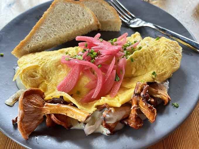 Golden eggs folded over mushrooms and pickled onions&mdash;breakfast elevated beyond your wildest dreams.