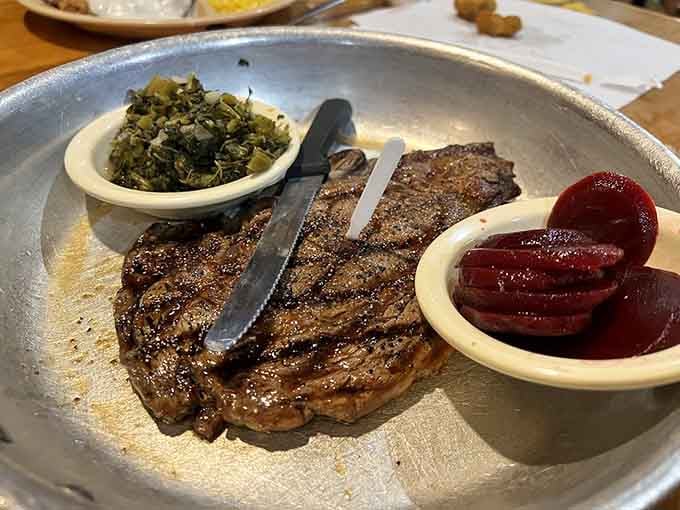 That ribeye's got char marks like a roadmap and comes with sides that make the steak look almost modest by comparison.