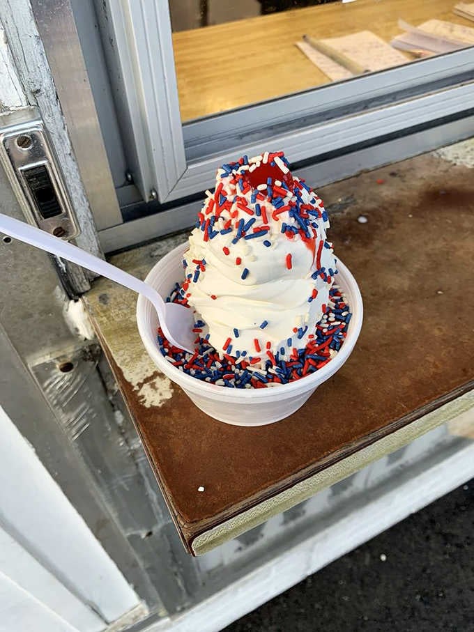 Patriotic sprinkles transform vanilla soft serve into a celebration worth saluting, no holiday required for this party.