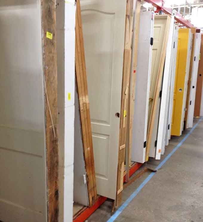 Doors of every style lined up like contestants on a home renovation game show, minus the dramatic eliminations.