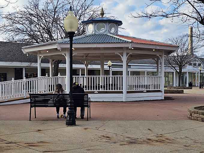 This charming gazebo offers weary shoppers a peaceful refuge, like an oasis in a desert of discounted merchandise.
