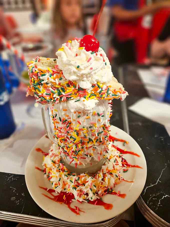 The Strawberry Fields Forever Shake towers with whipped cream, sprinkles, and enough sweetness to inspire Beatles lyrics.