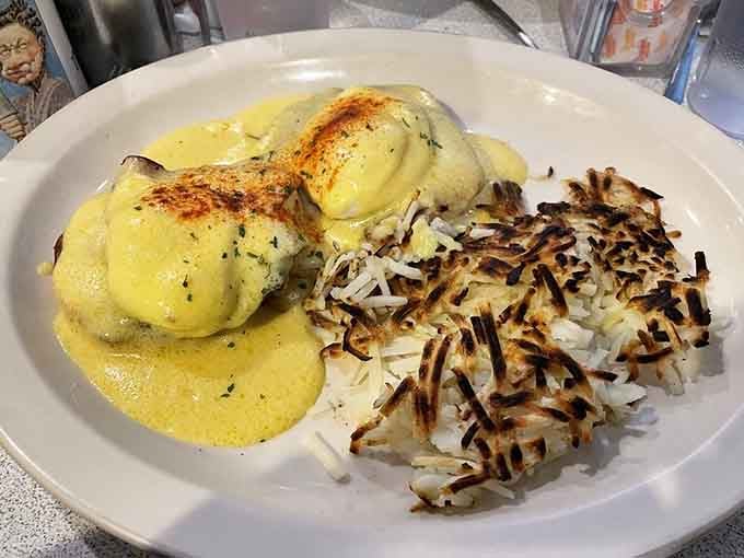 Eggs Benedict with perfectly crispy hash browns proves that classic diner fare never goes out of style, theme or not.