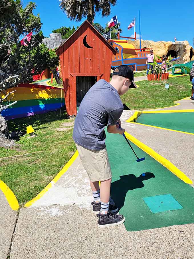 Nothing says "serious athlete" quite like a kid intensely focused on conquering a par-two hole.