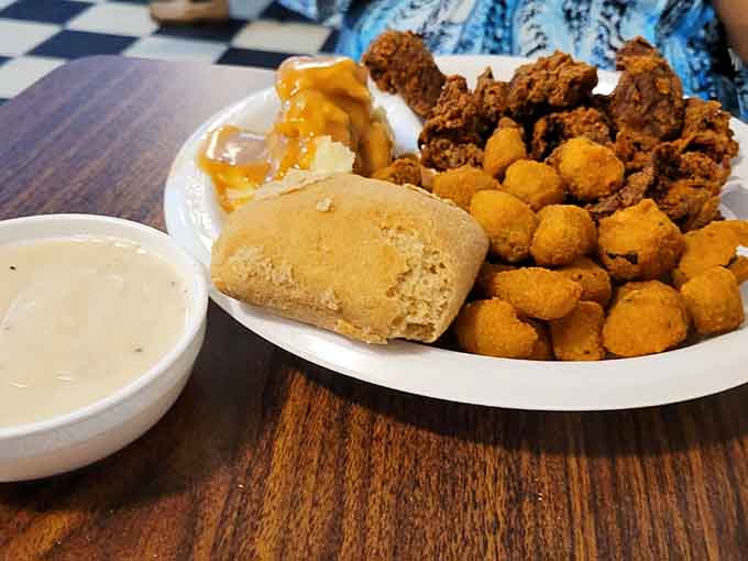 Golden fried chicken livers and crispy okra prove that Southern comfort food doesn't need complications, just commitment.