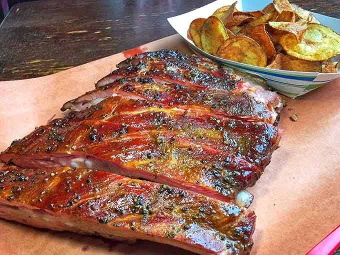 Those ribs paired with crispy chips prove that sometimes the simplest combinations create the most memorable meals together.
