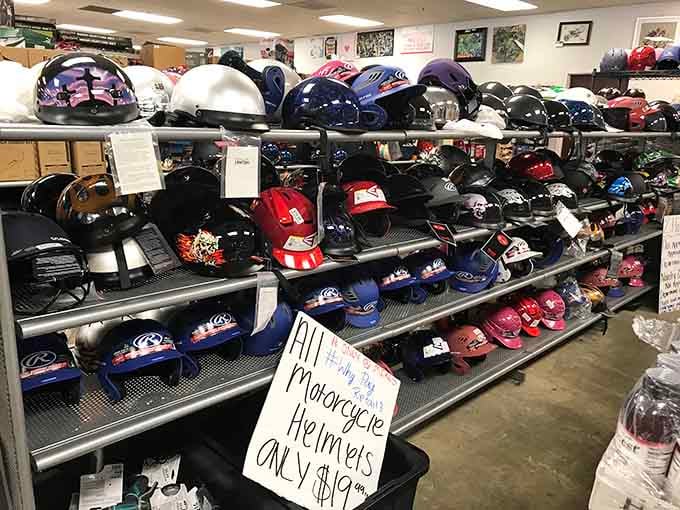 Motorcycle helmets lined up like a rainbow of road safety, because protecting your noggin shouldn't cost a fortune.