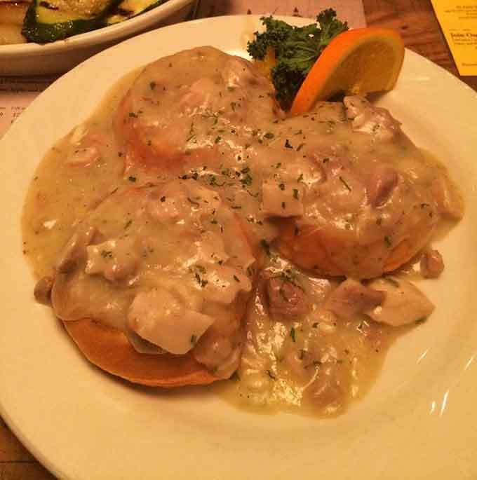 Chicken and waffles swimming in gravy, because sometimes breakfast and dinner need to have a conversation.