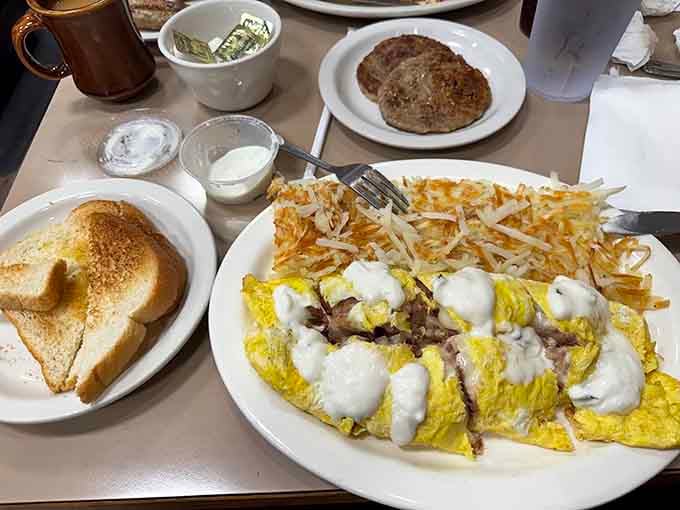 That omelette looks like it could double as a fluffy pillow, except eating pillows is generally frowned upon.