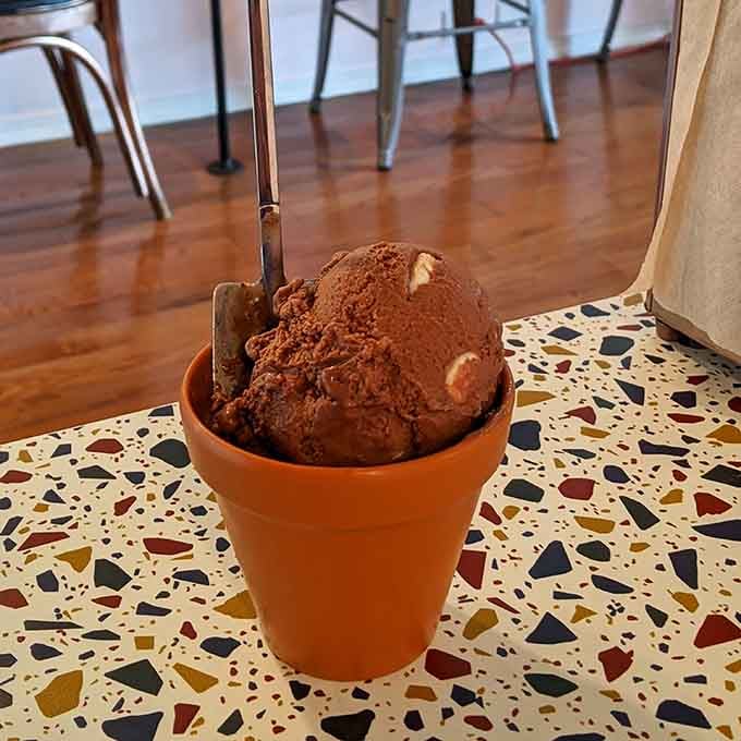 Coffee crunch in a terracotta cup proves that plant-based doesn't mean flavor-compromised, just delicious and inclusive.