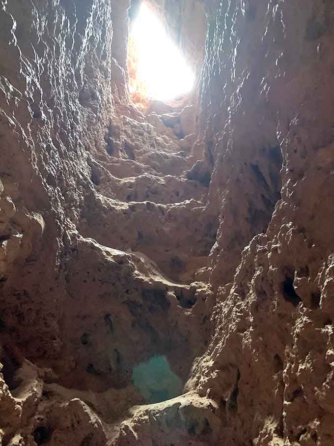 Looking up through the tunnel feels like peering through a geological kaleidoscope toward freedom.