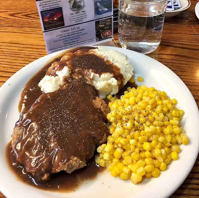 Behold the country fried steak that inspired this entire pilgrimage, swimming gloriously in peppery gravy perfection.