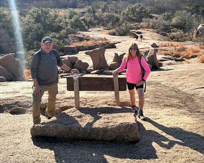 Two adventurers pause to contemplate the ancient rocks, probably wondering if they left the oven on back home.