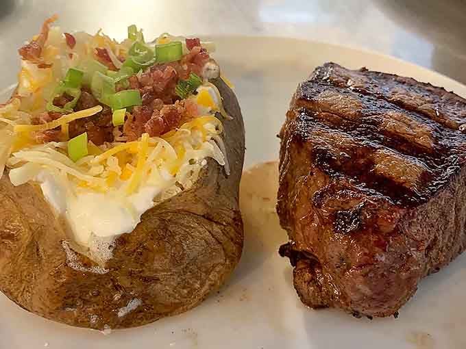 That perfectly seared steak next to a loaded baked potato is basically the definition of comfort on a plate.