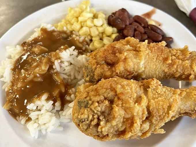 Golden fried chicken with rice, gravy, and sides that'll make you understand why this is comfort food royalty.