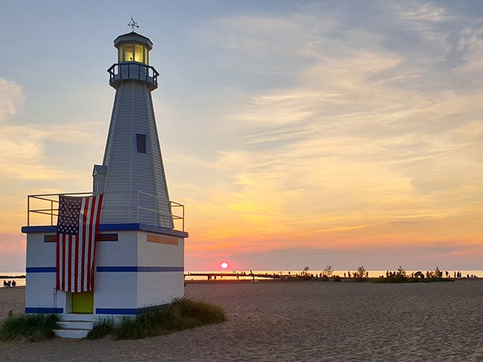 The lighthouse stands guard like a patriotic sentinel, reminding you that some traditions never go out of style.