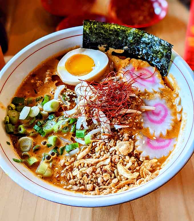 The Tantanmen arrives looking like edible art, with toppings arranged so beautifully you almost feel guilty diving in.