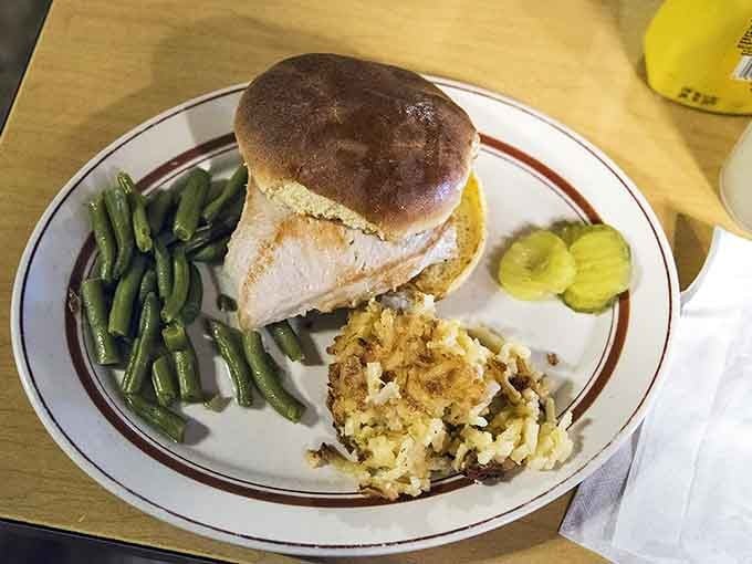 This grilled chicken breast sandwich comes with sides that mean business, no skimping on the good stuff here.