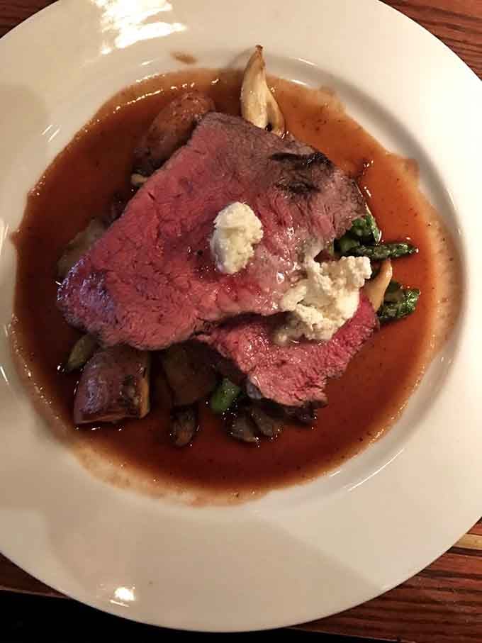 Medium-rare perfection with goat cheese and au jus&mdash;this is what steak dreams are made of, folks.