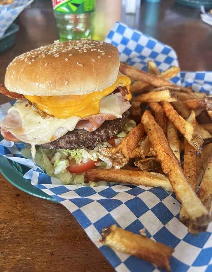 The Trail Burger arrives stacked high with everything you need after conquering those winding mountain roads.