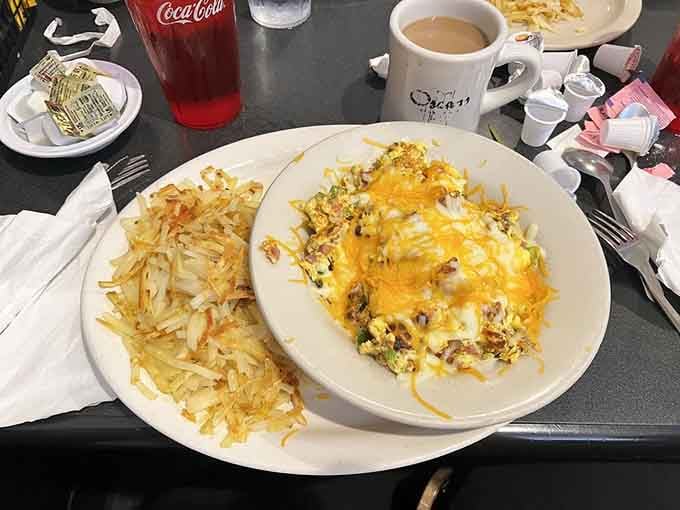 Golden hash browns meet a loaded omelet in this breakfast masterpiece that understands portion control is just a suggestion.