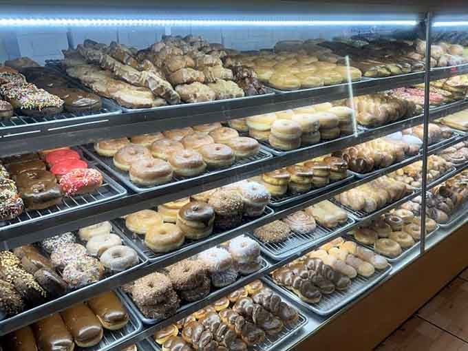 Rows upon rows of fresh donuts waiting patiently to make someone's morning infinitely better than it was.