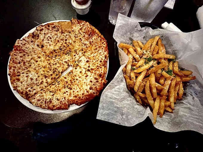 Golden, bubbly cheese pizza perfection that proves simple done right beats fancy every time.