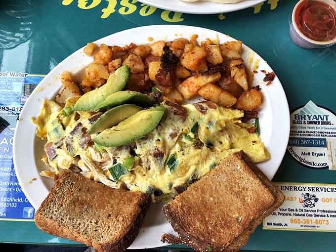 Golden home fries, perfectly cooked eggs, and avocado slices that prove breakfast is the most important meal period.