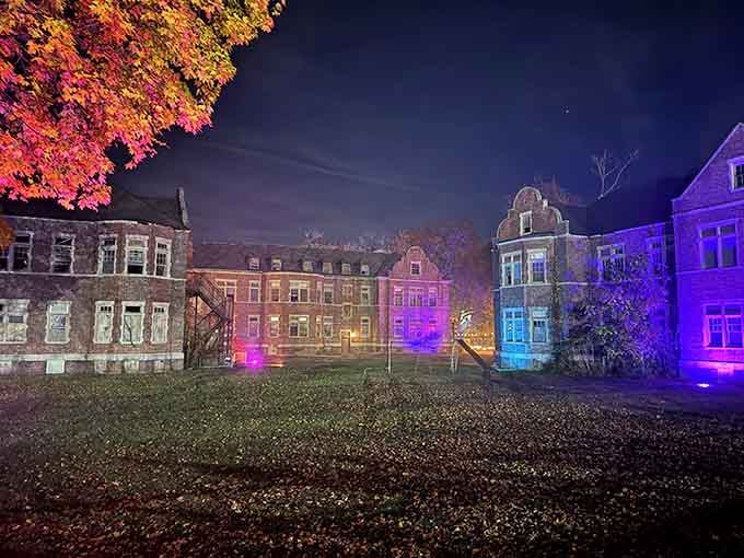 The nighttime illumination creates an almost carnival atmosphere over a place with such heavy history.