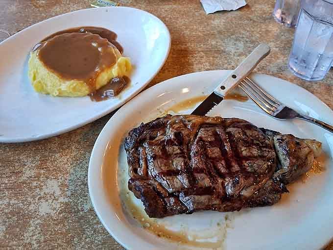 That perfectly grilled steak with mashed potatoes and gravy proves diners can deliver steakhouse quality without the stuffy atmosphere.
