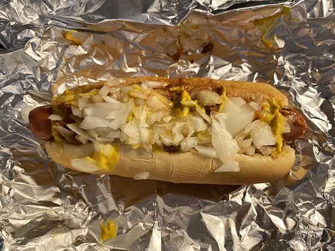 A classic Coney Island dog wrapped in foil like a delicious silver present you get to unwrap immediately.